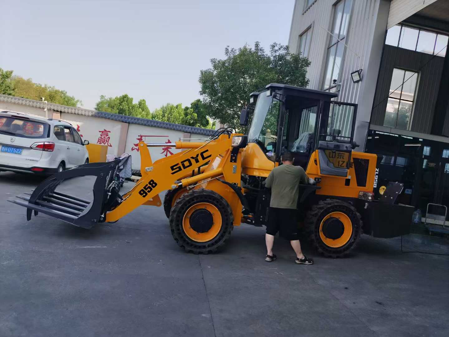 Excavators and loaders are ready to be shipped in containers ...